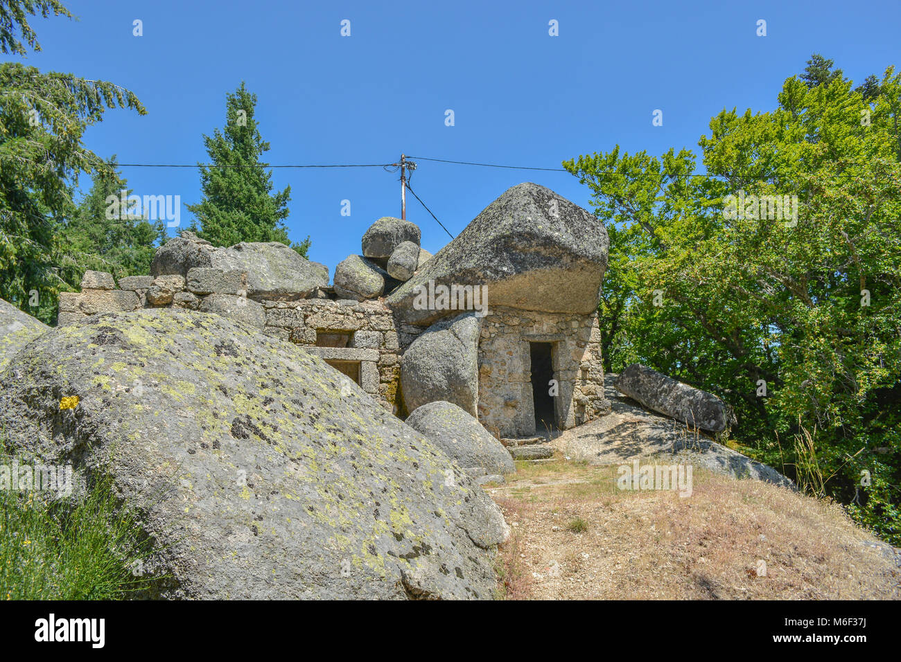 house inside the rocks, on the top of the mountain Stock Photo - Alamy
