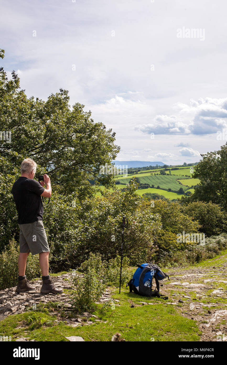 Man stops to admire the view and take photographs on Hergest Ridge ...