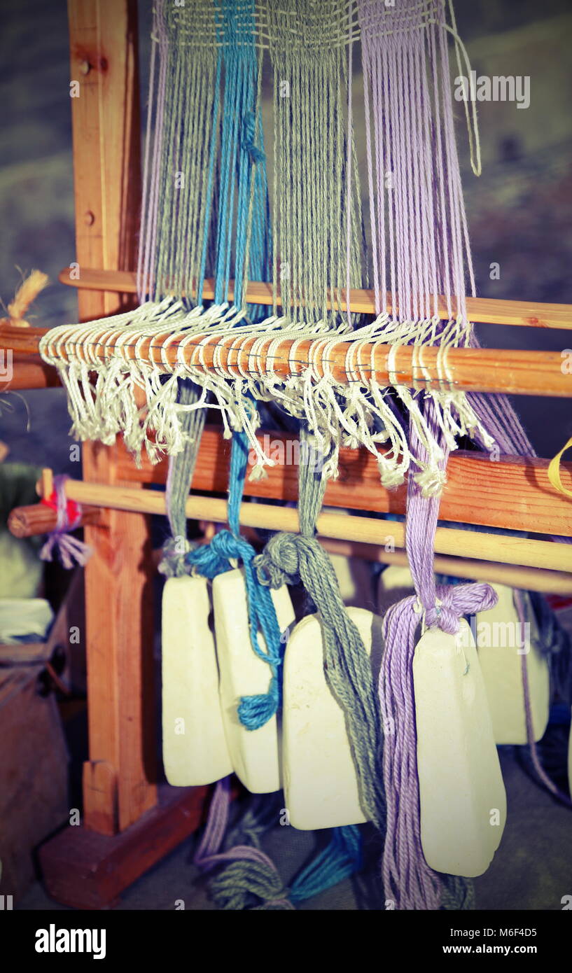 ancient wooden frame for the weaving of woolen threads with heavy ...