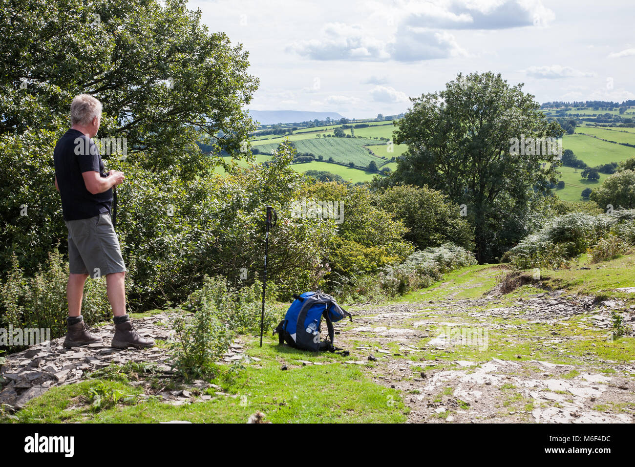 Man stops to admire the view and take photographs on Hergest Ridge ...