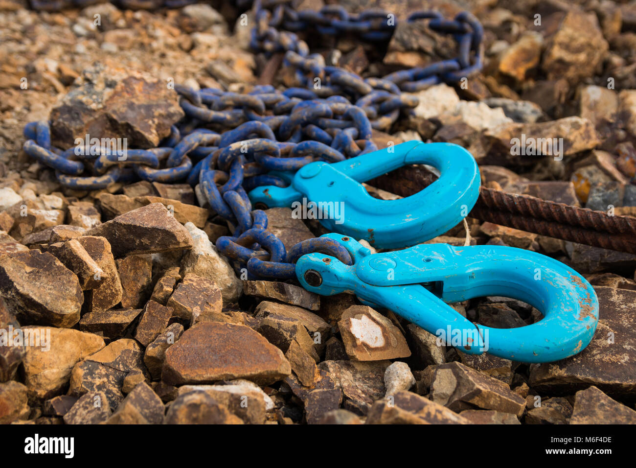 Blue color chain with two hooks Stock Photo - Alamy