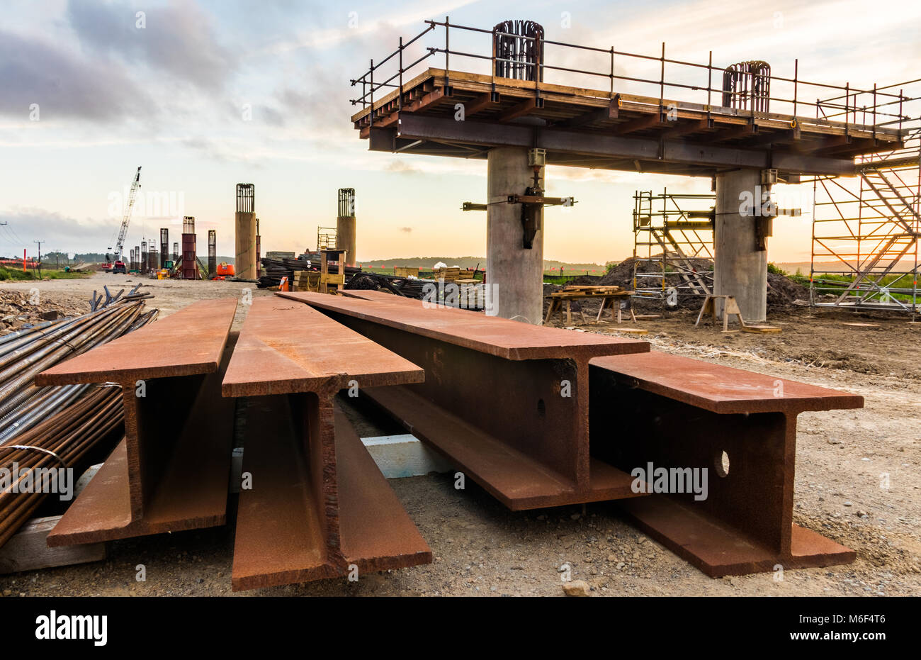 New bridge getting built with a use of a crain Stock Photo - Alamy