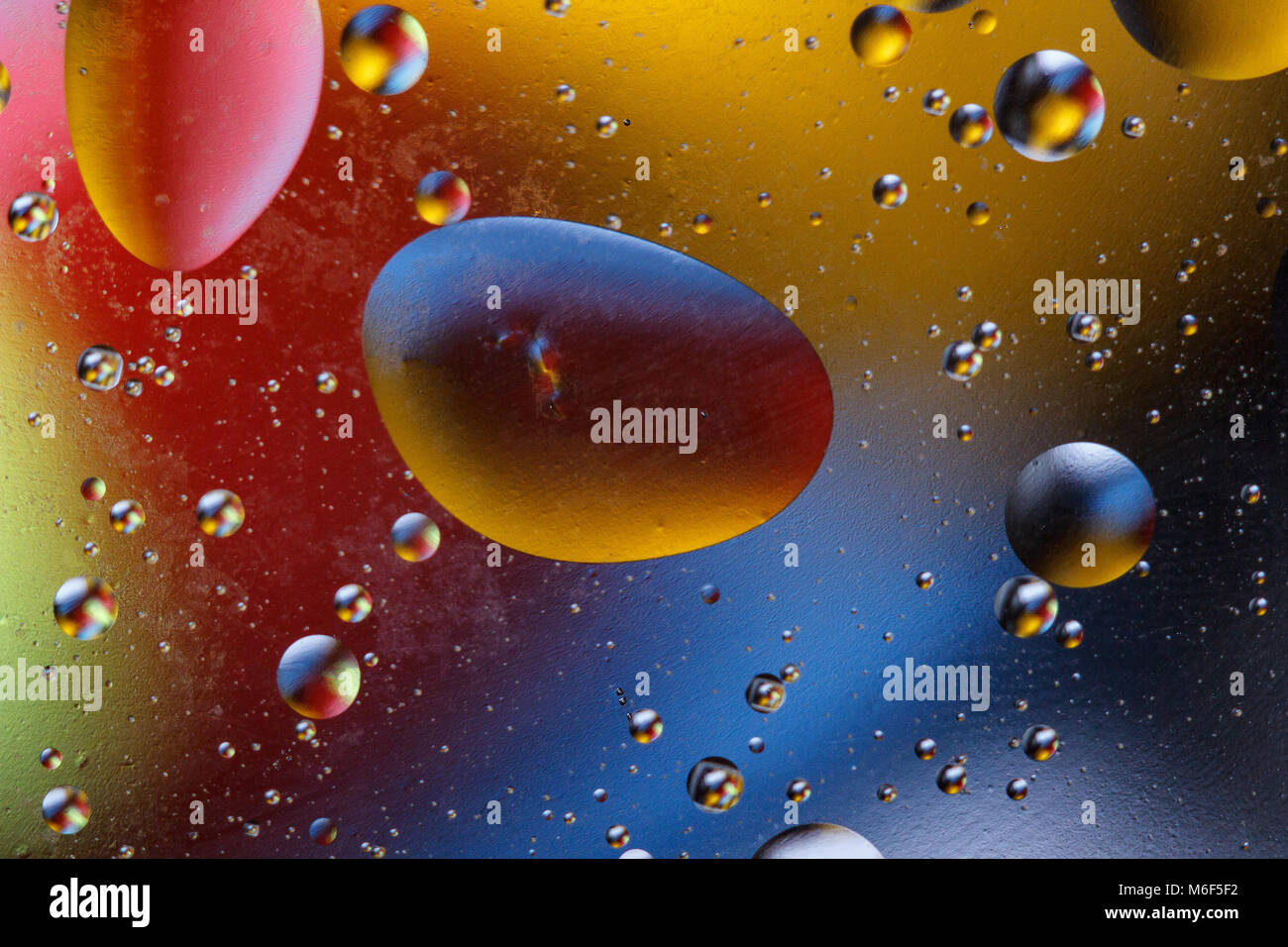 Abstract image with colorful circles and shapeless bodies on a colored ...