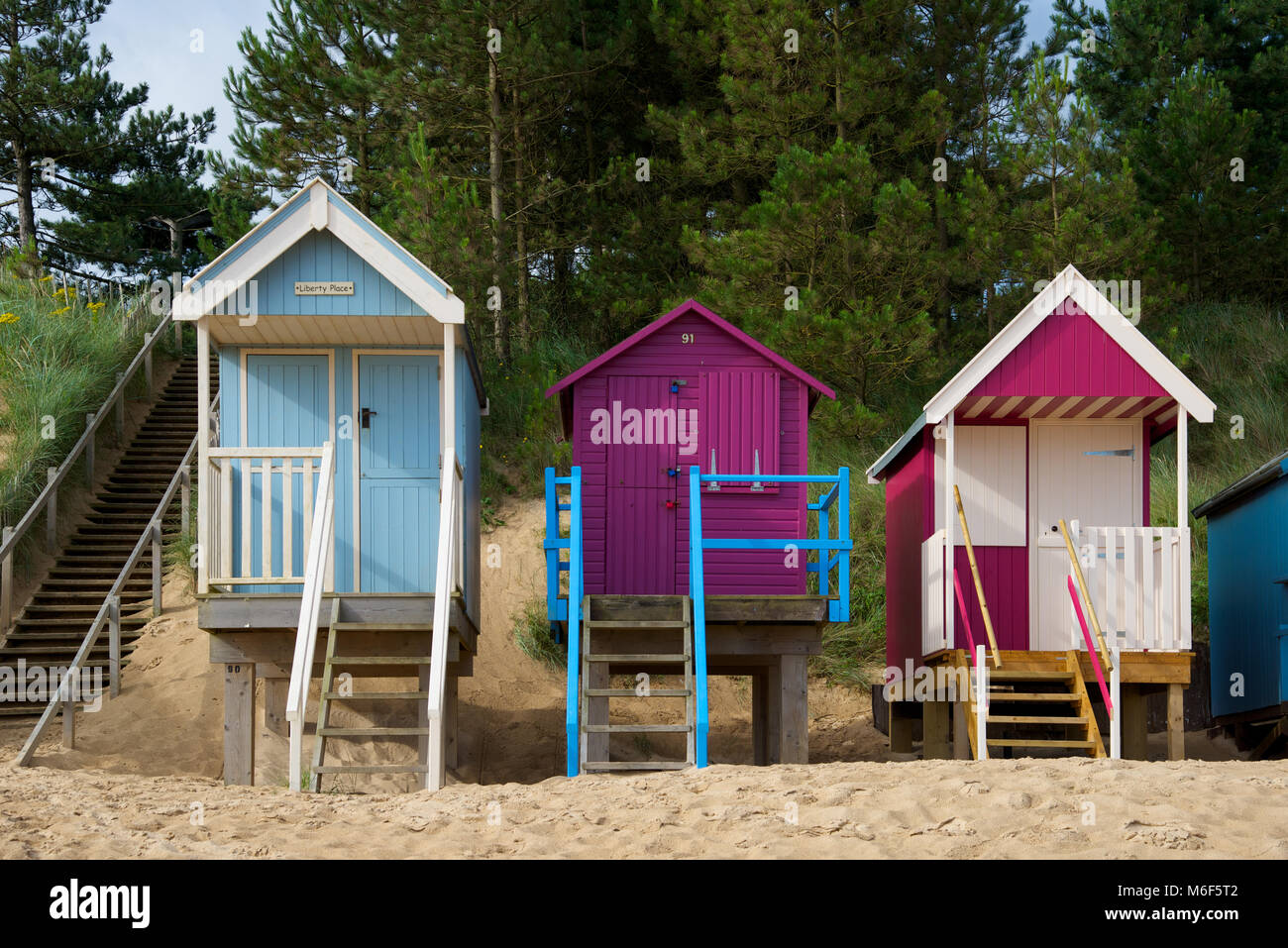 Brightly coloured beach huts at Wells-next-the-Sea, Norfolk, England ...