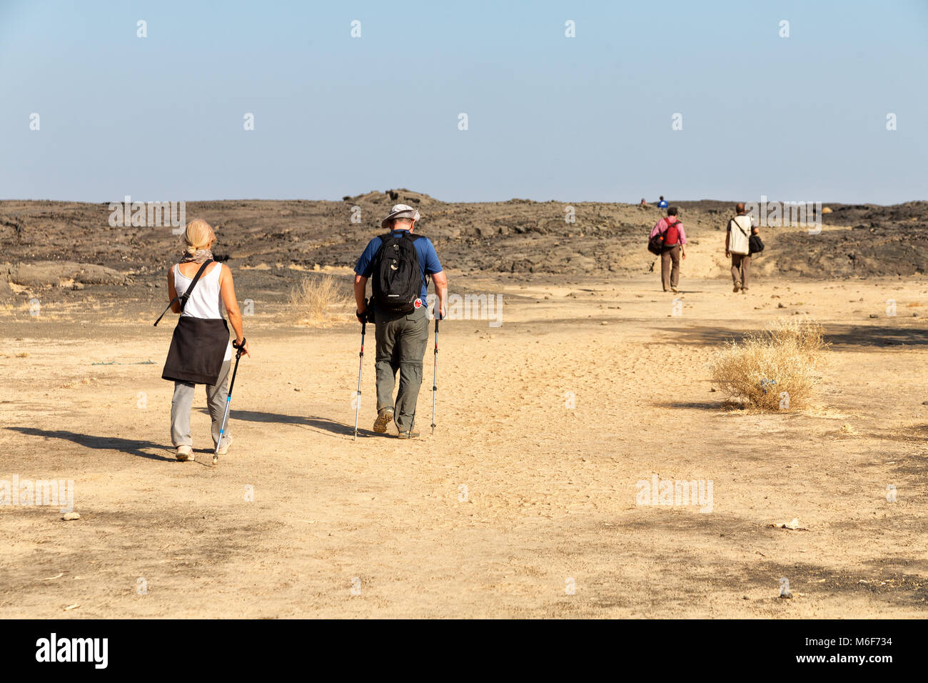 in danakil ethiopia africa the old backpacker people walking in the ...