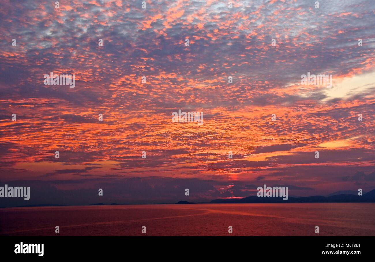 Dramatic Red sky and clouds after sunset over sea Stock Photo - Alamy
