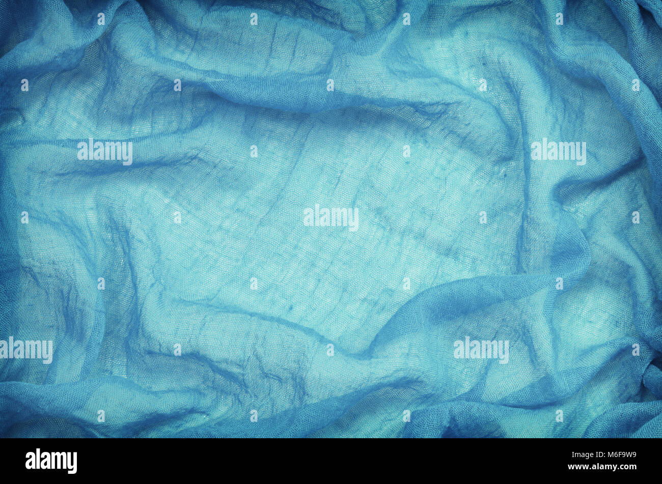 Closeup of blue folded fabric for background. Flat lay. Top view Stock ...