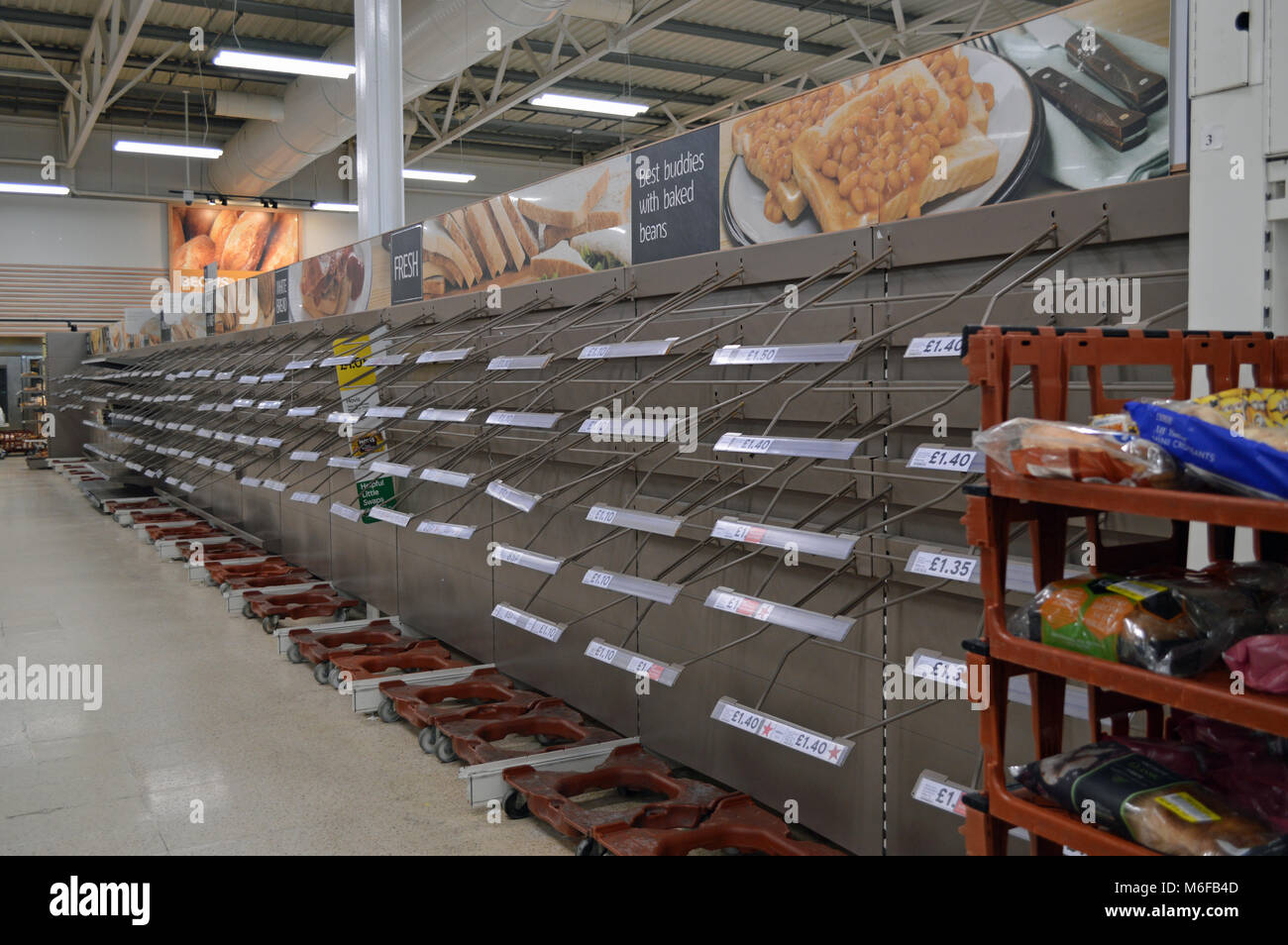 Post snow, low stocks on supermarket shelves in Tesco Fforestfach Stock ...
