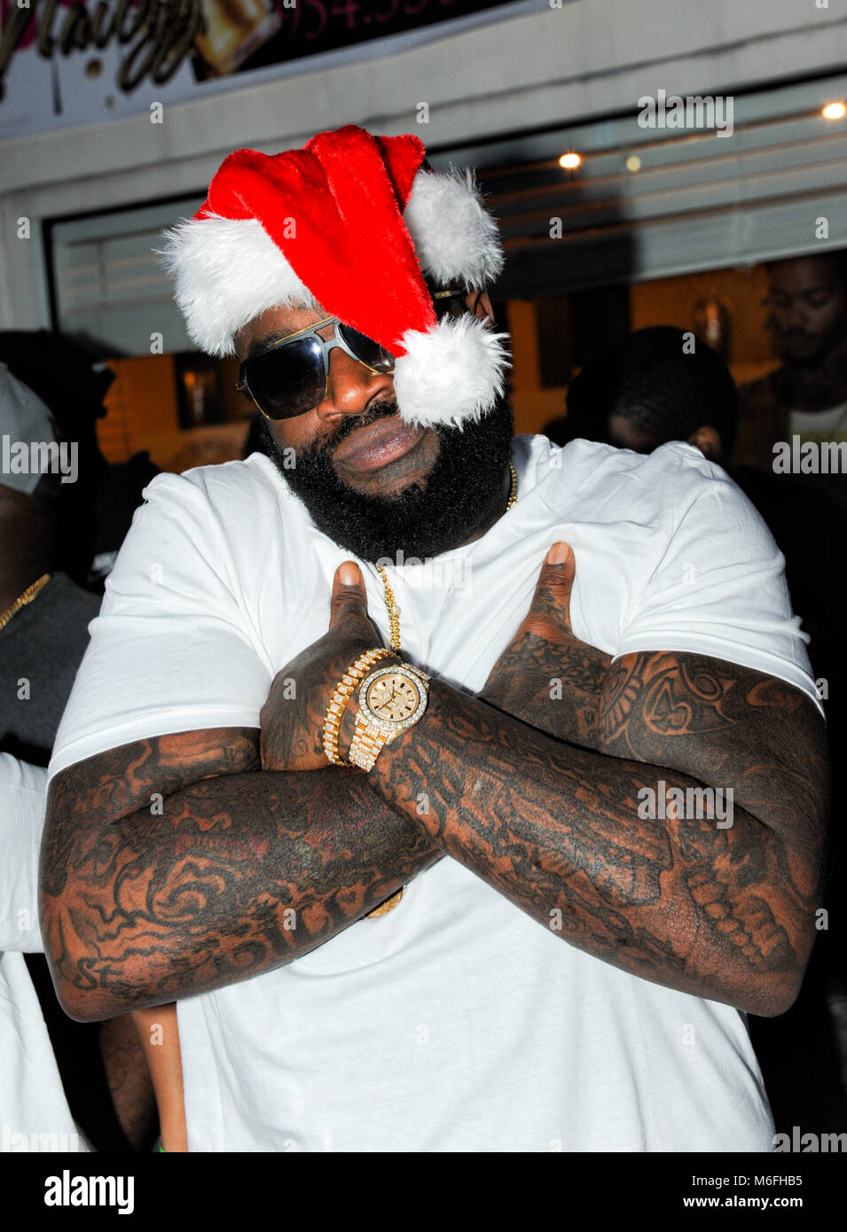 FORT LAUDERDALE, FL - DECEMBER 19: Rick Ross and other charitable ...