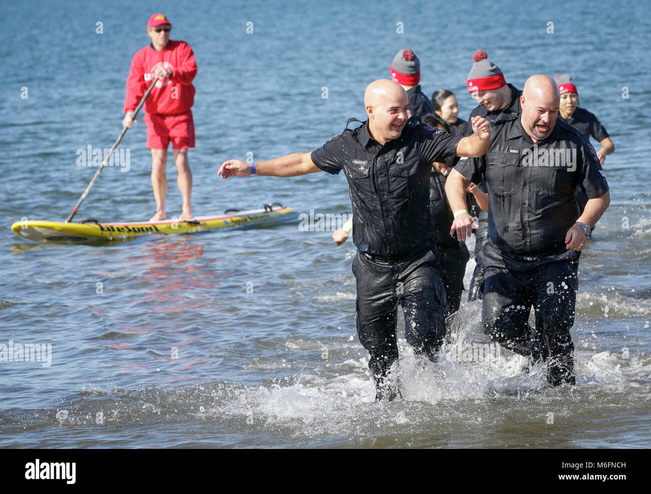 Vancouver, Canada. 3rd Mar, 2018. Police officers dip into the water to ...