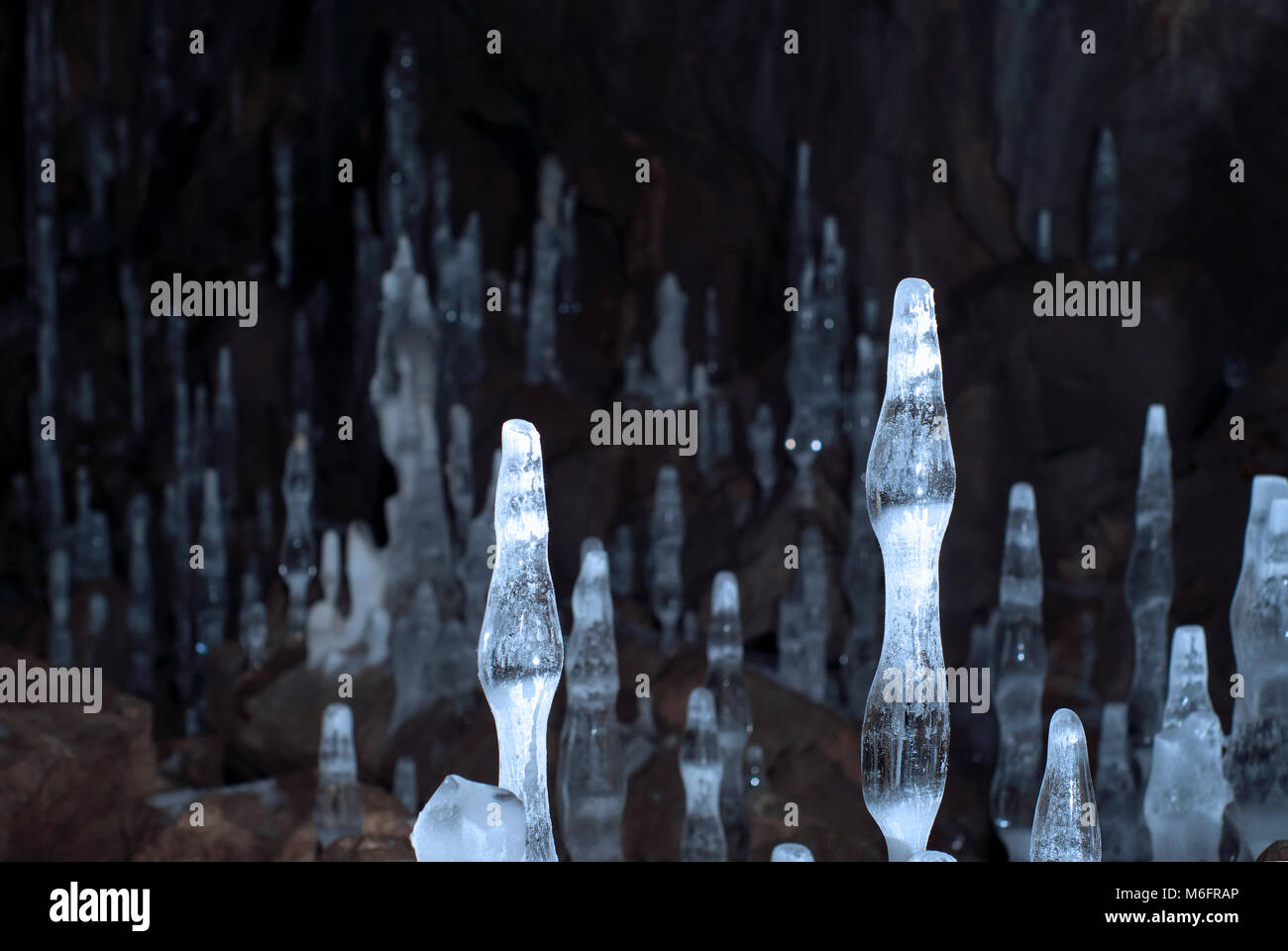 ice formations in a dark underground cave Stock Photo - Alamy