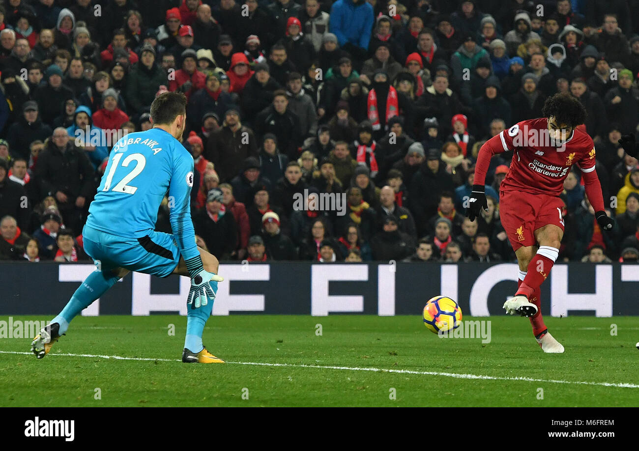 Liverpool's Mohamed Salah scores his side's first goal of the game ...