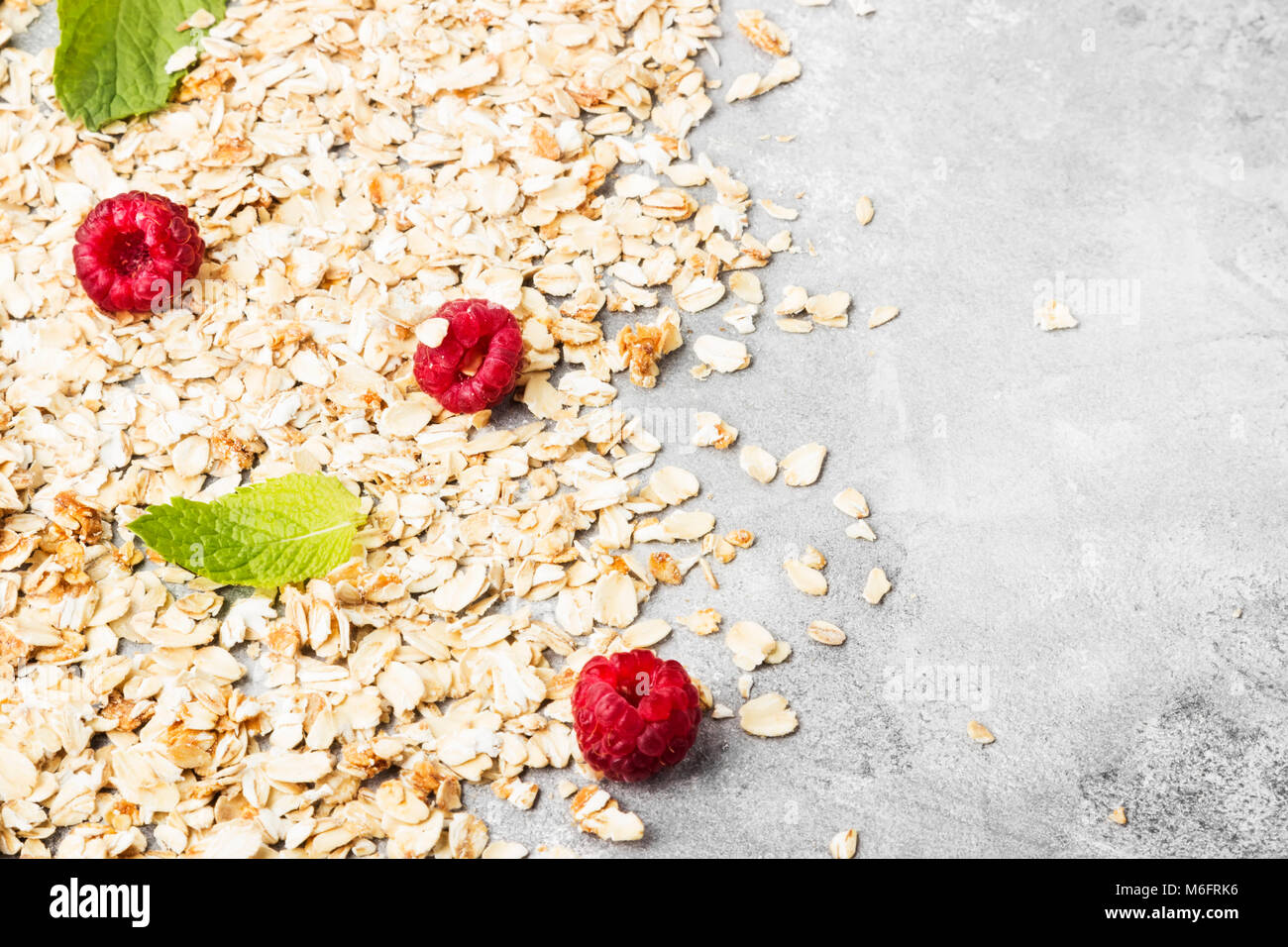 Glanola with raspberry and mint. Copy space. Food background Stock ...