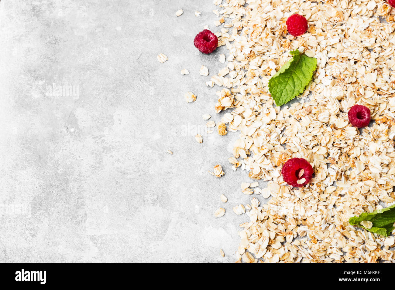 Glanola with raspberry and mint. Copy space. Food background Stock ...