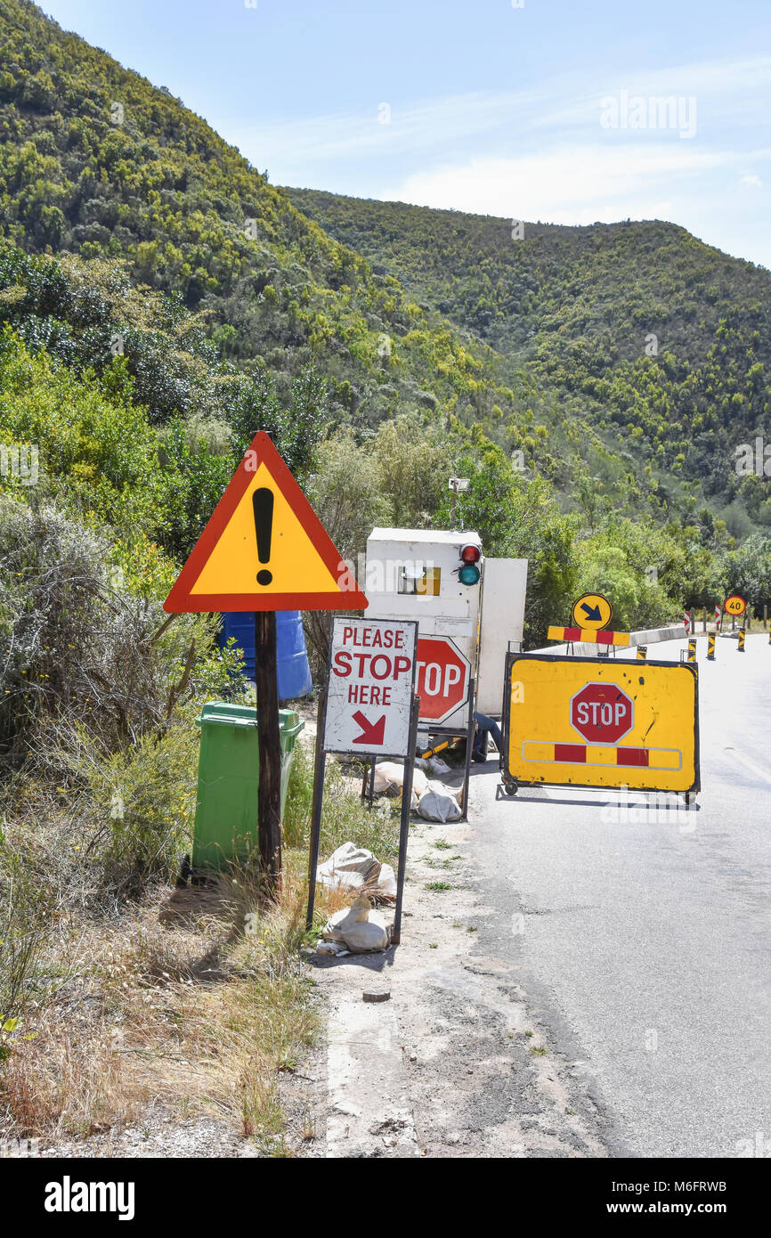 A yellow and red road is temporarily closed sign in South Africa near ...