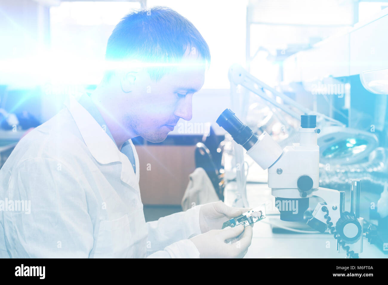 Computer expert professional technician examining board computer in a ...