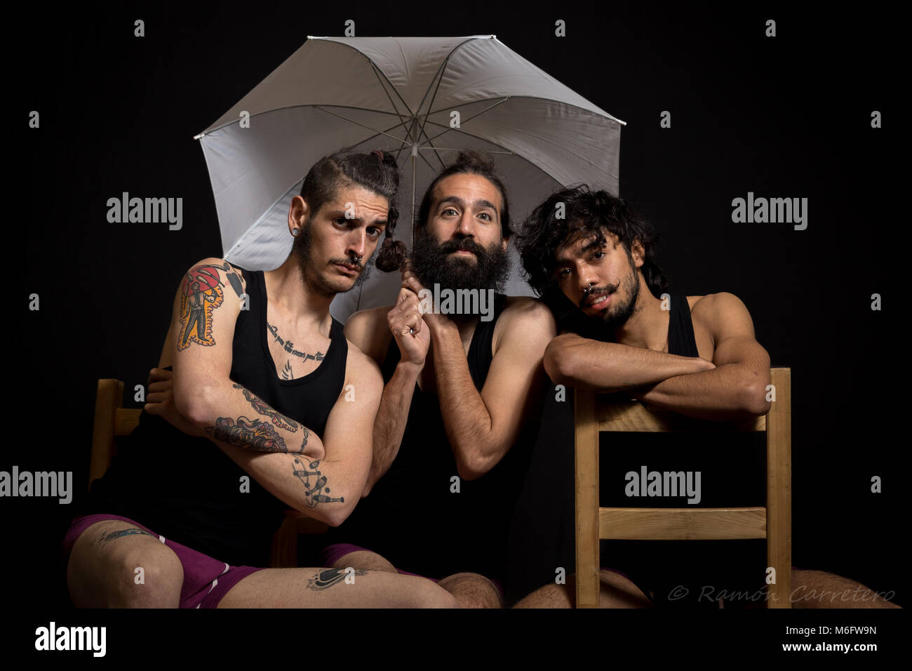 Three circus artists and friends having fun after their performance ...