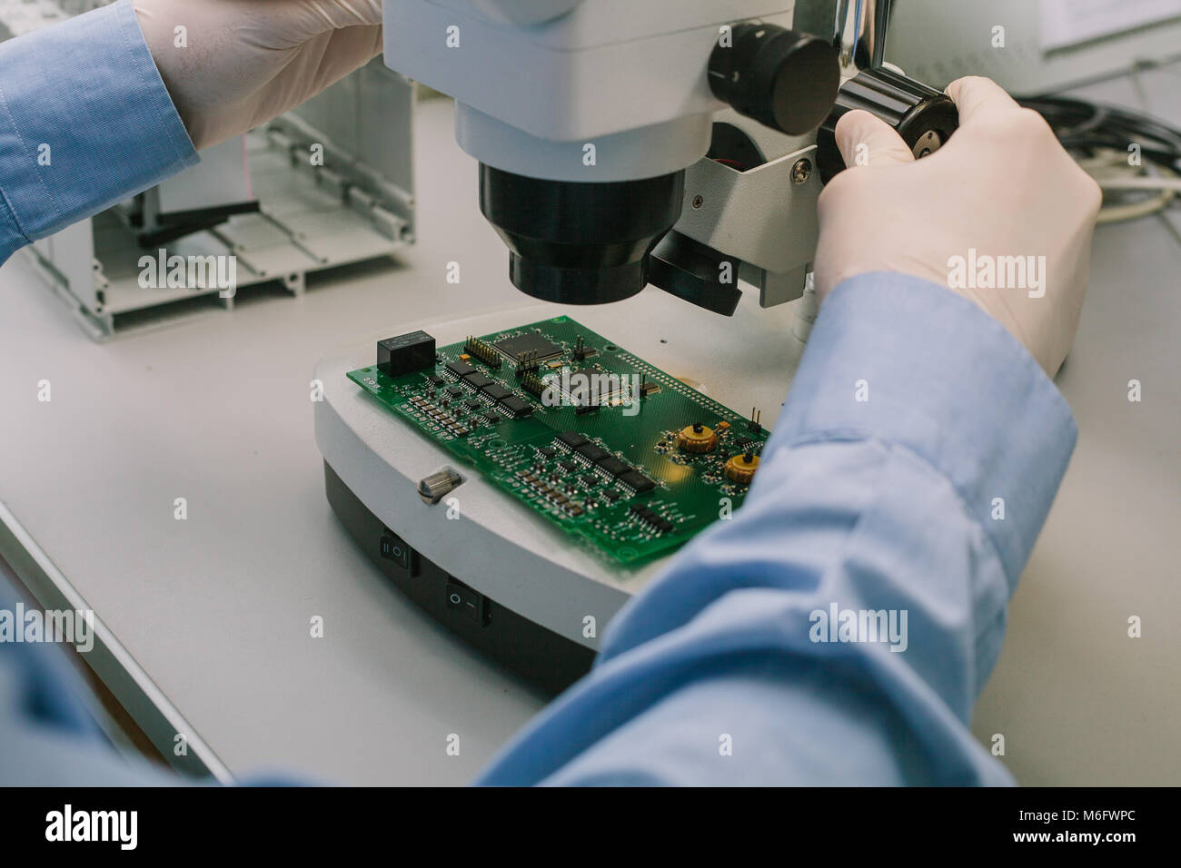 Computer expert professional technician examining board computer in a ...