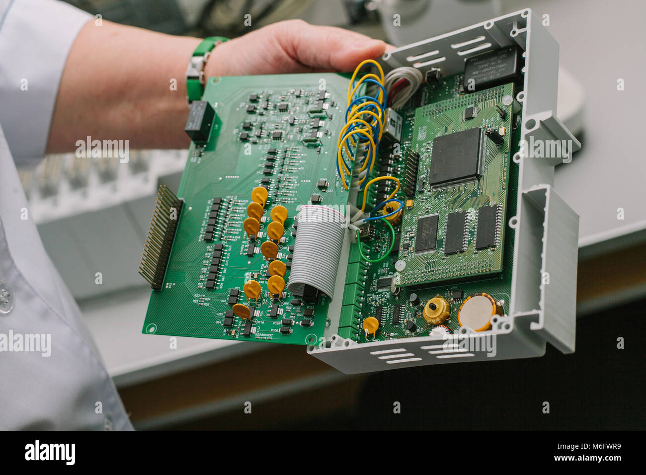 Computer expert professional technician examining board computer in a ...