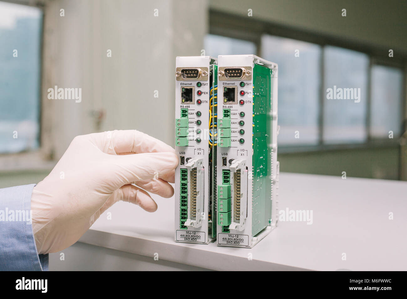 Computer expert professional technician examining board computer in a ...