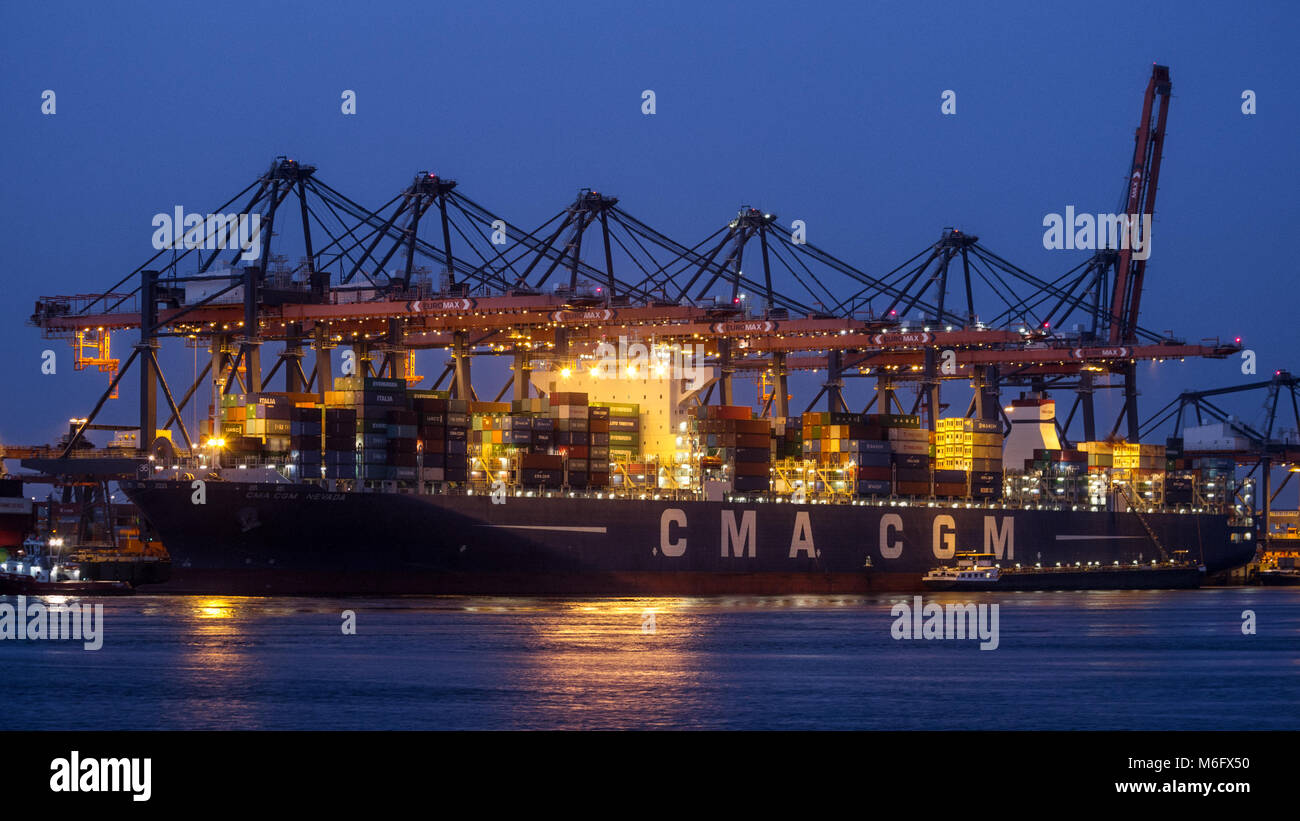 ROTTERDAM - JUL 9, 2012: Container ship being unloaded in the Port of ...
