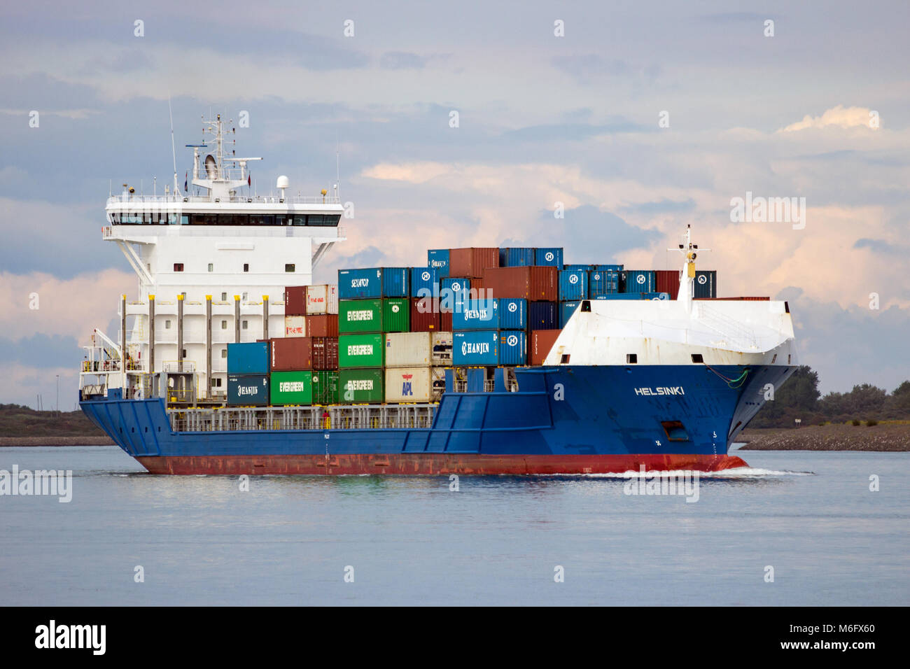 ROTTERDAM - SEP 8, 2013: Cargo container ship leaving the Port of ...