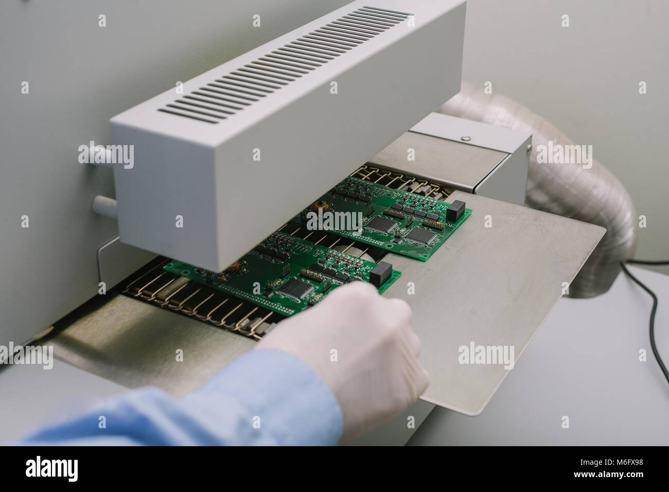 Computer expert professional technician examining board computer in a ...