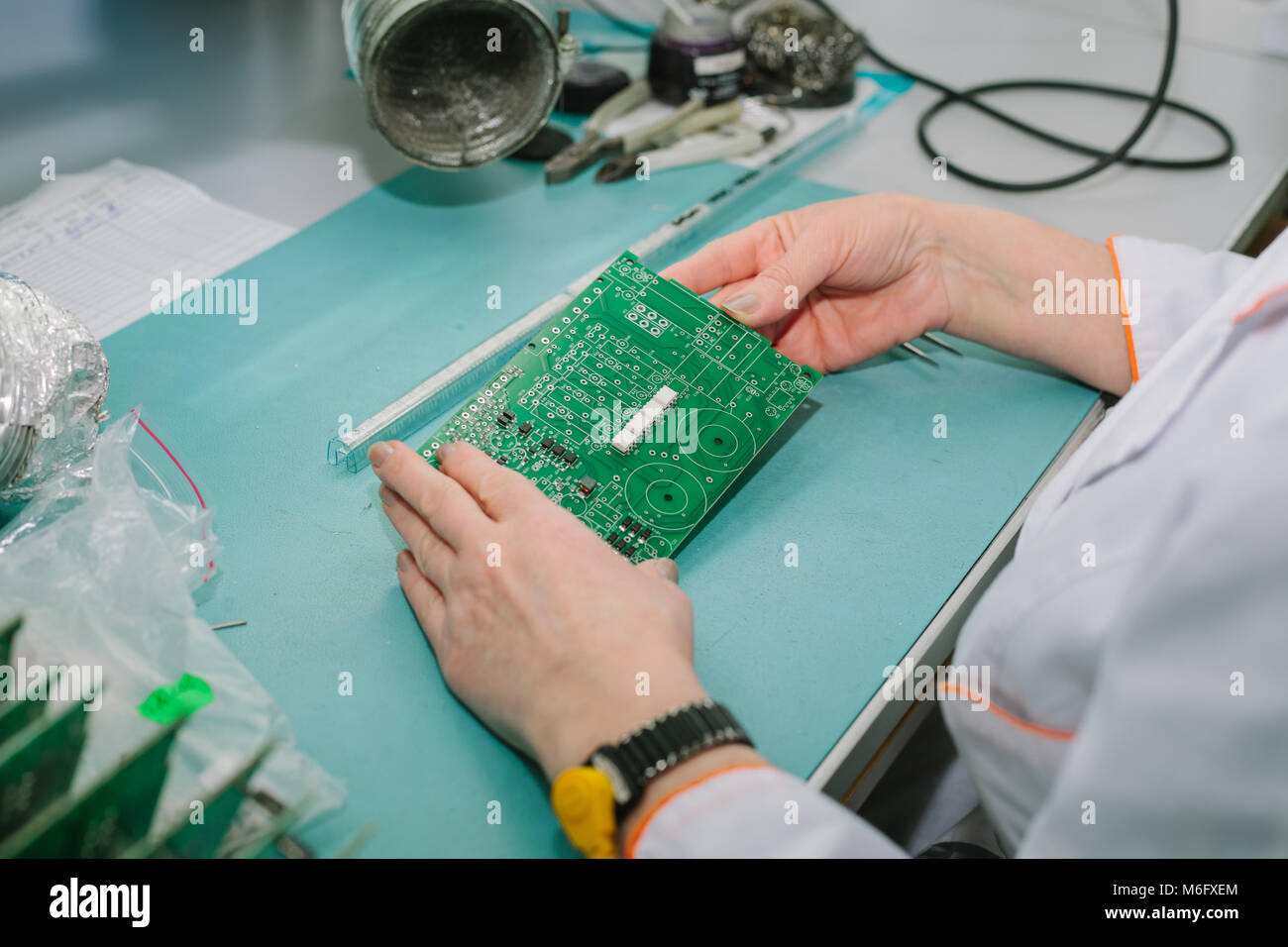 Computer expert professional technician examining board computer in a ...