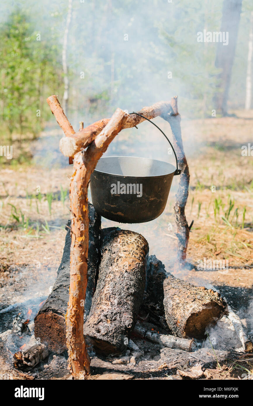 The fire near the camp. Cooking food on a fire. Journey into the wild ...
