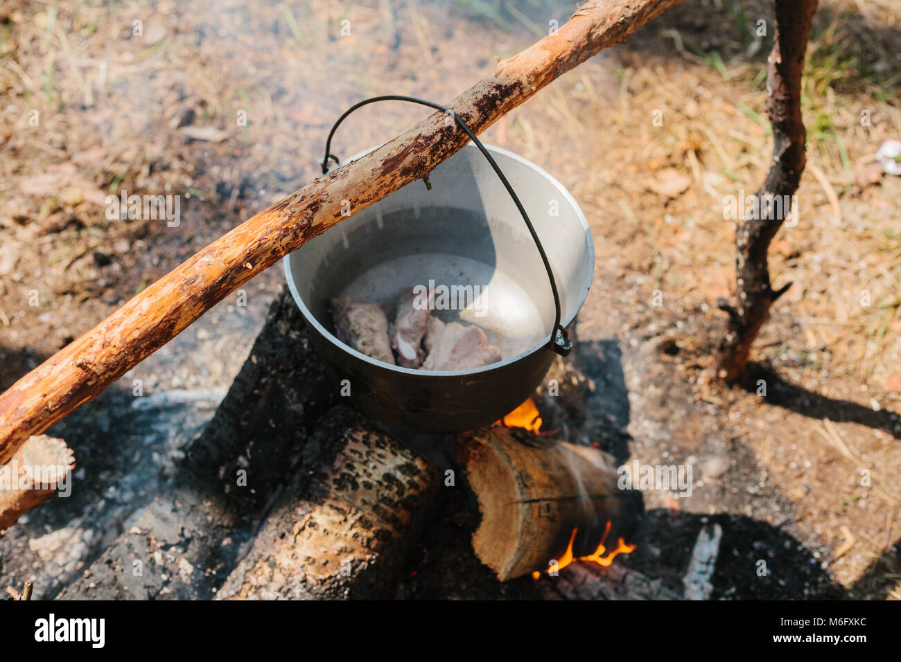 The fire near the camp. Cooking food on a fire. Journey into the wild ...