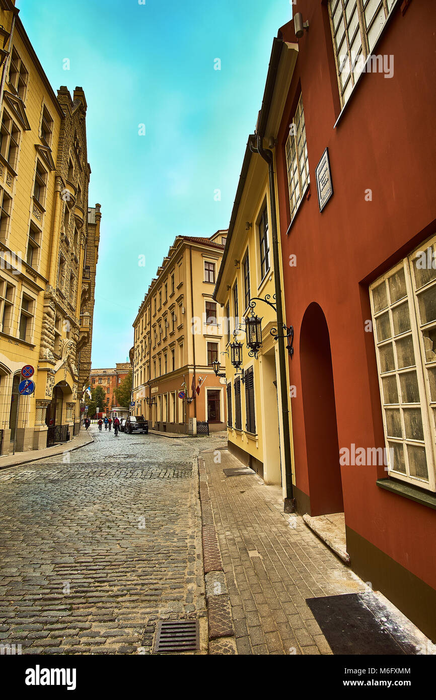Old medieval morning narrow street in Riga, Latvia. Retro styled Stock ...