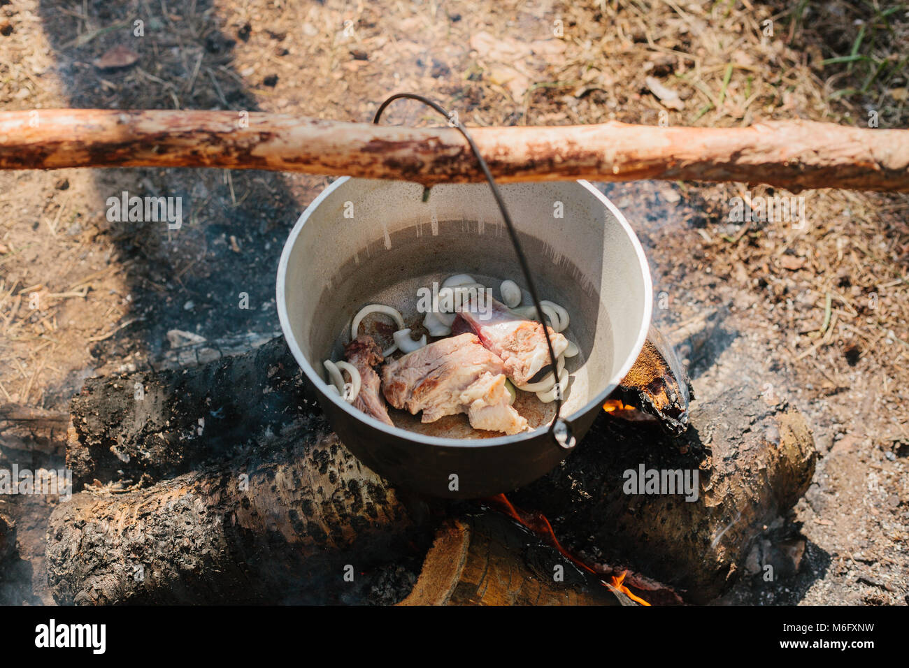 The fire near the camp. Cooking food on a fire. Journey into the wild ...