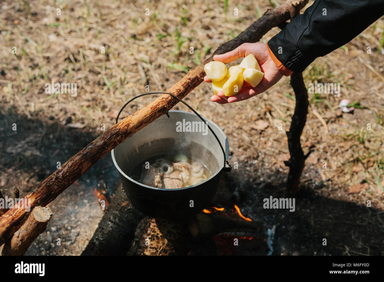 The fire near the camp. Cooking food on a fire. Journey into the wild ...