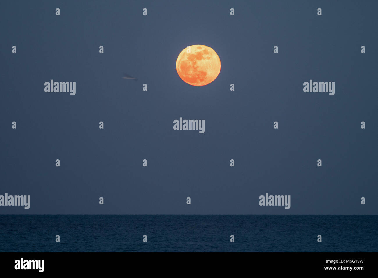 The supermoon over the Mediterranean Sea in Corigliano Calabro, Italy ...