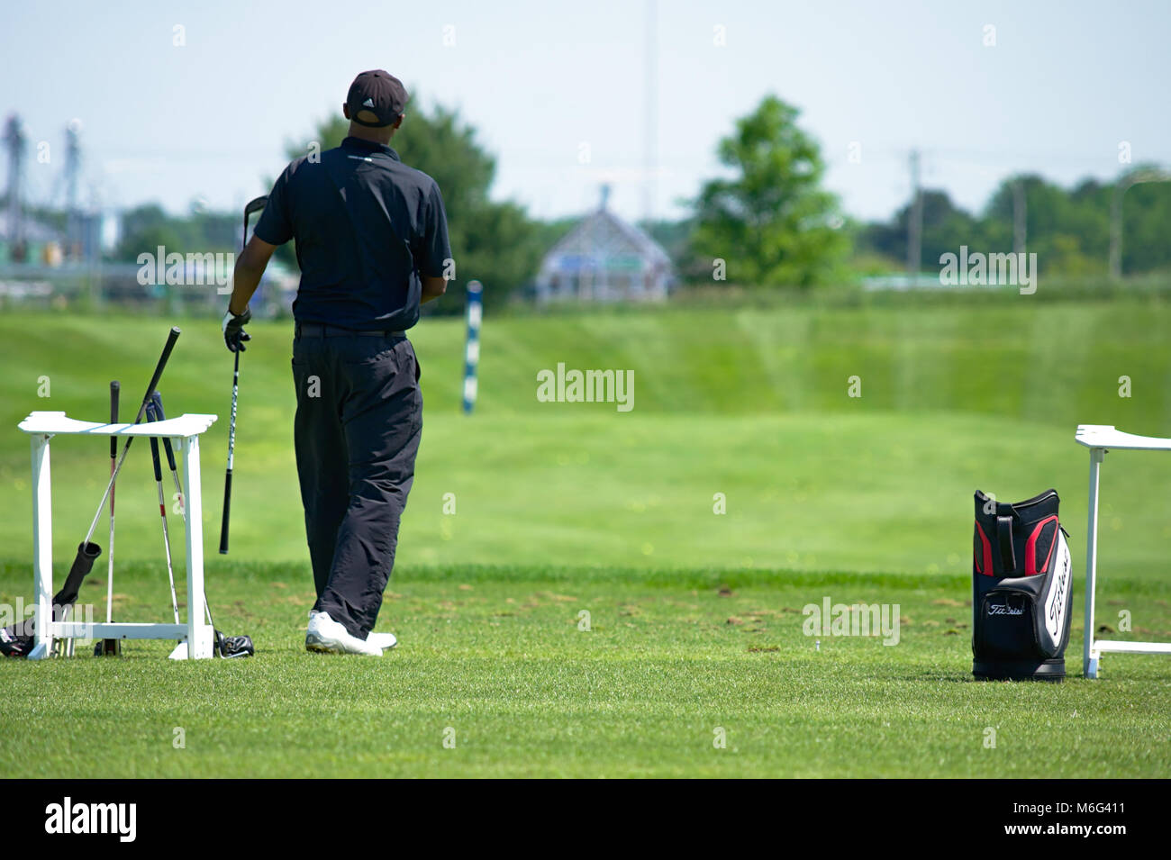 golfers on the range practicing before their round Stock Photo - Alamy