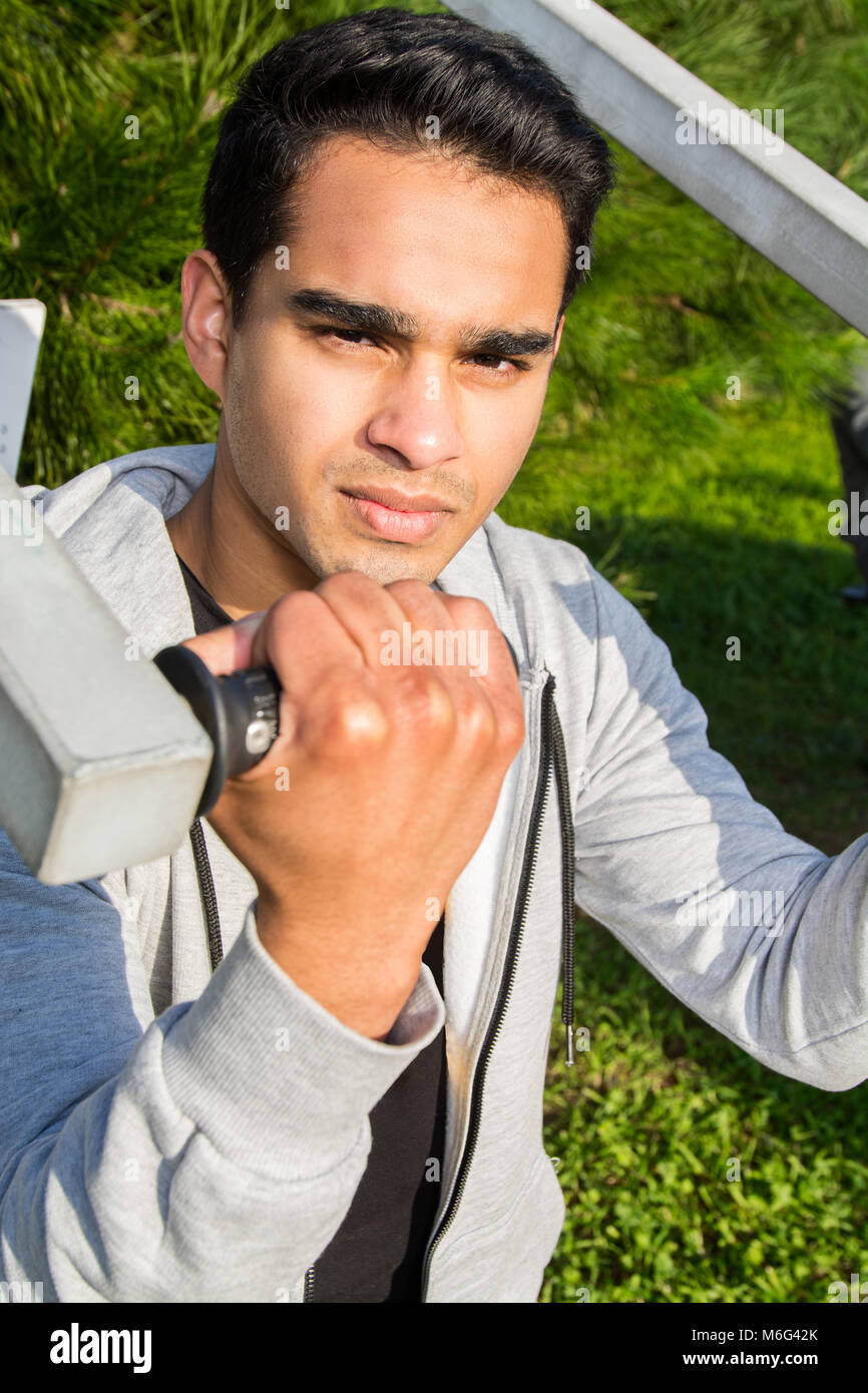 young man making exercise, working on work bench Stock Photo - Alamy