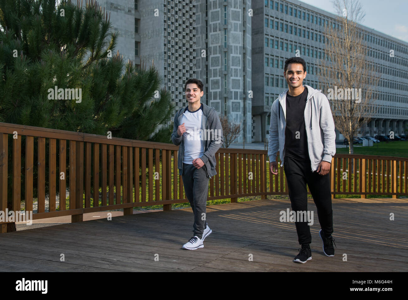 Sporty friends walking hi-res stock photography and images - Alamy