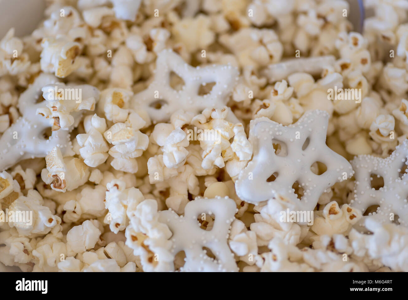overhead closeup of winter themed popcorn with white chocolate pretzels ...