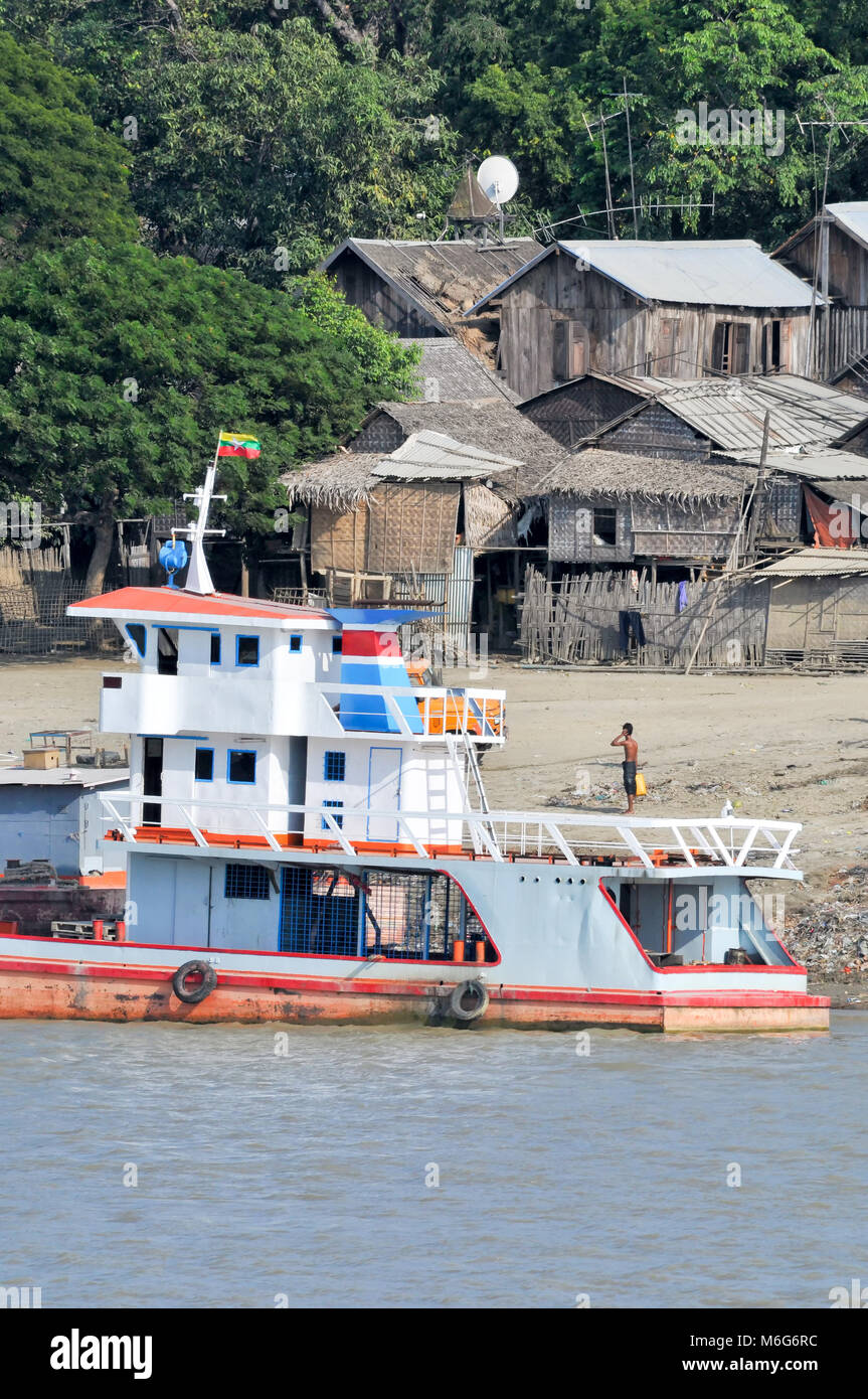 A view of the Irrawaddy River in Myanmar Burma with a small village in ...