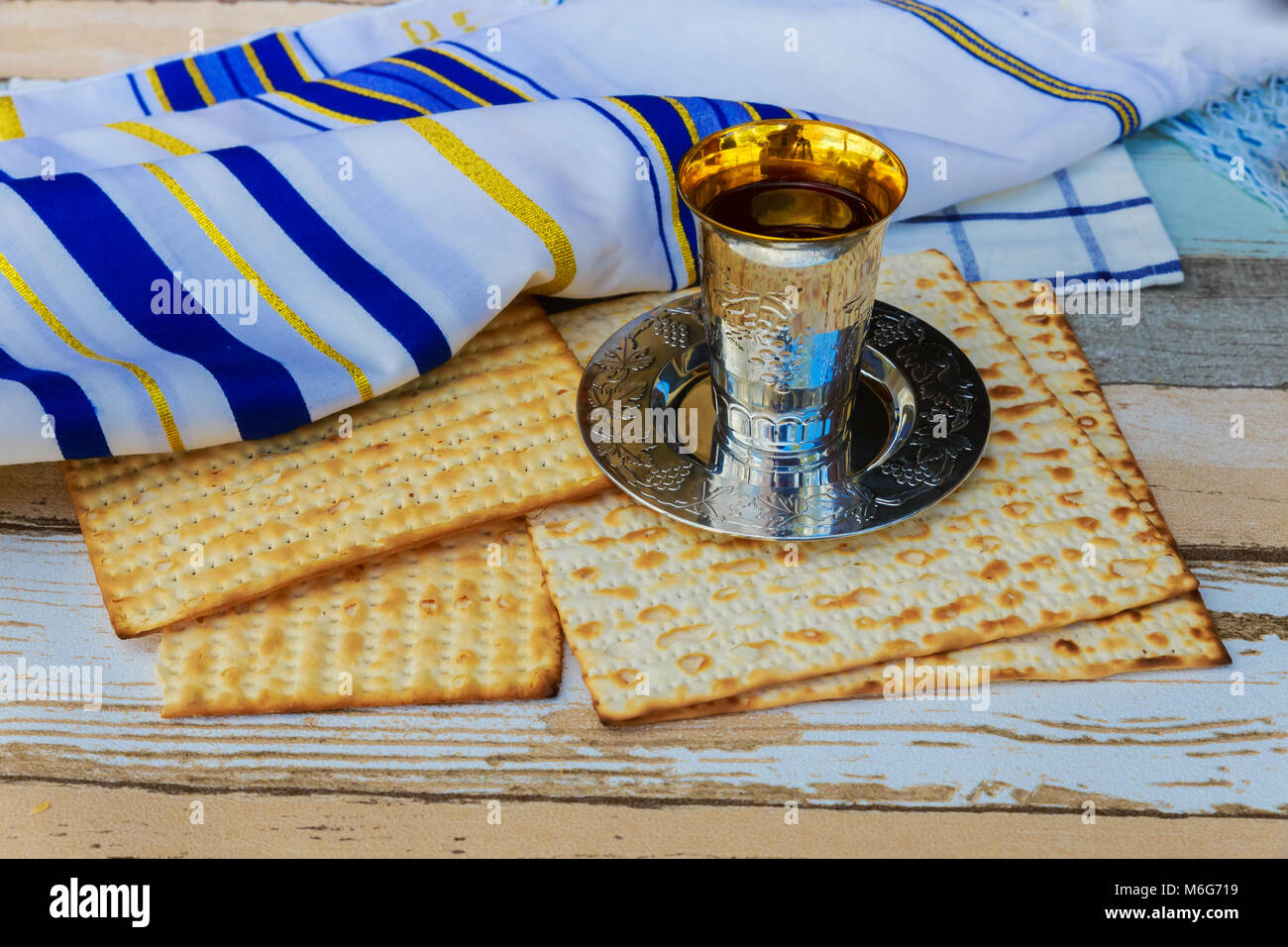 Silver wine cup with matzah, Jewish symbols for the Passover Pesach ...