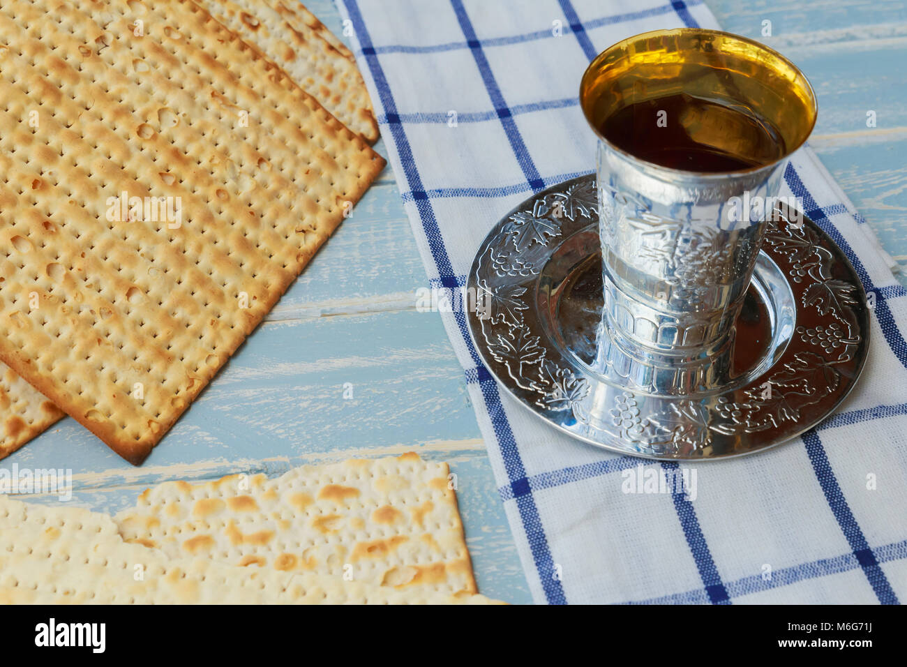 Silver wine cup with matzah, Jewish symbols for the Passover Pesach ...