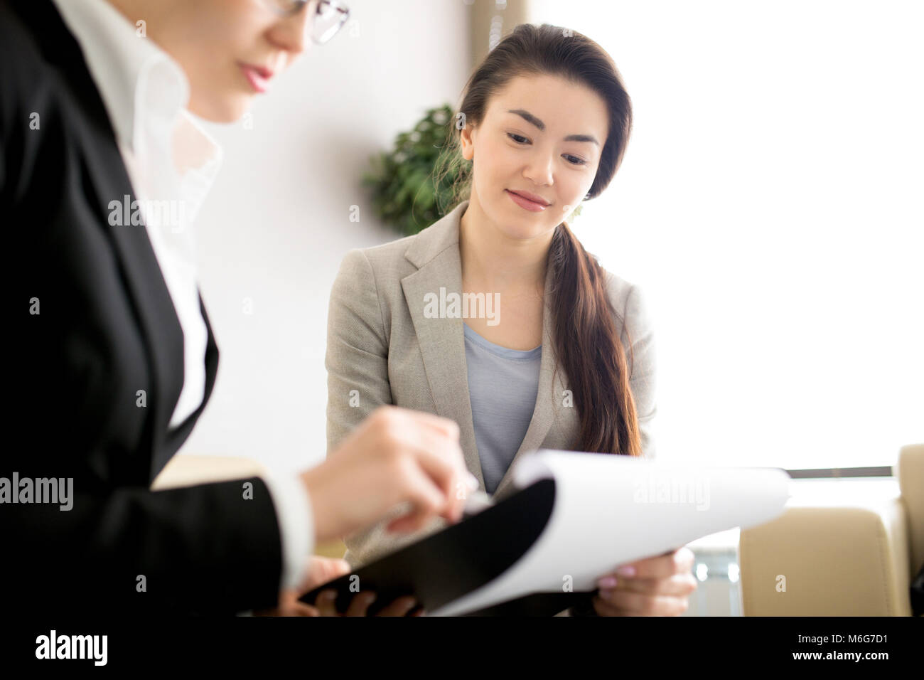 Presenting Creative Ideas to Colleague Stock Photo - Alamy