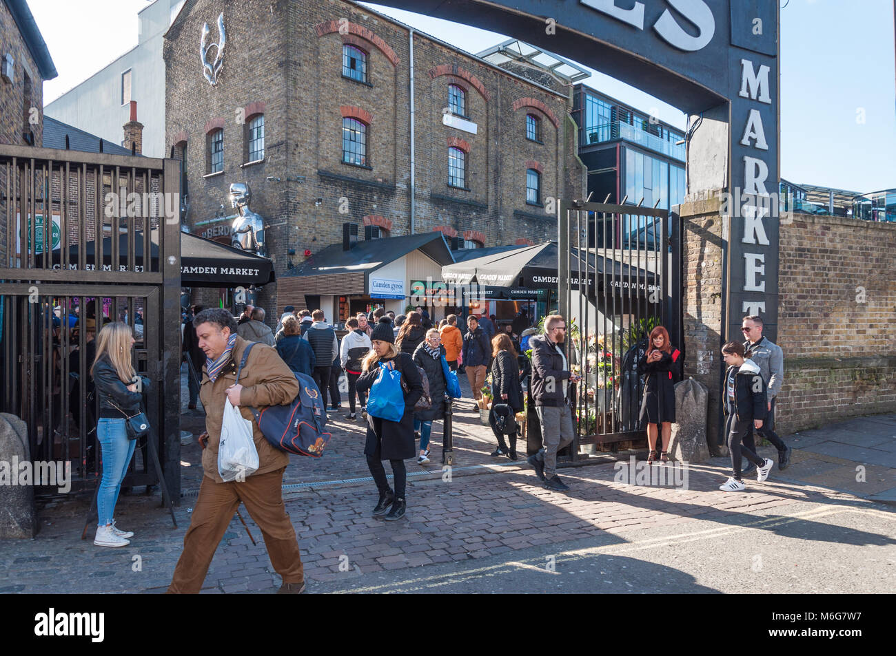 Saturday shoppers at and around the entrance to The Stables, Camden ...