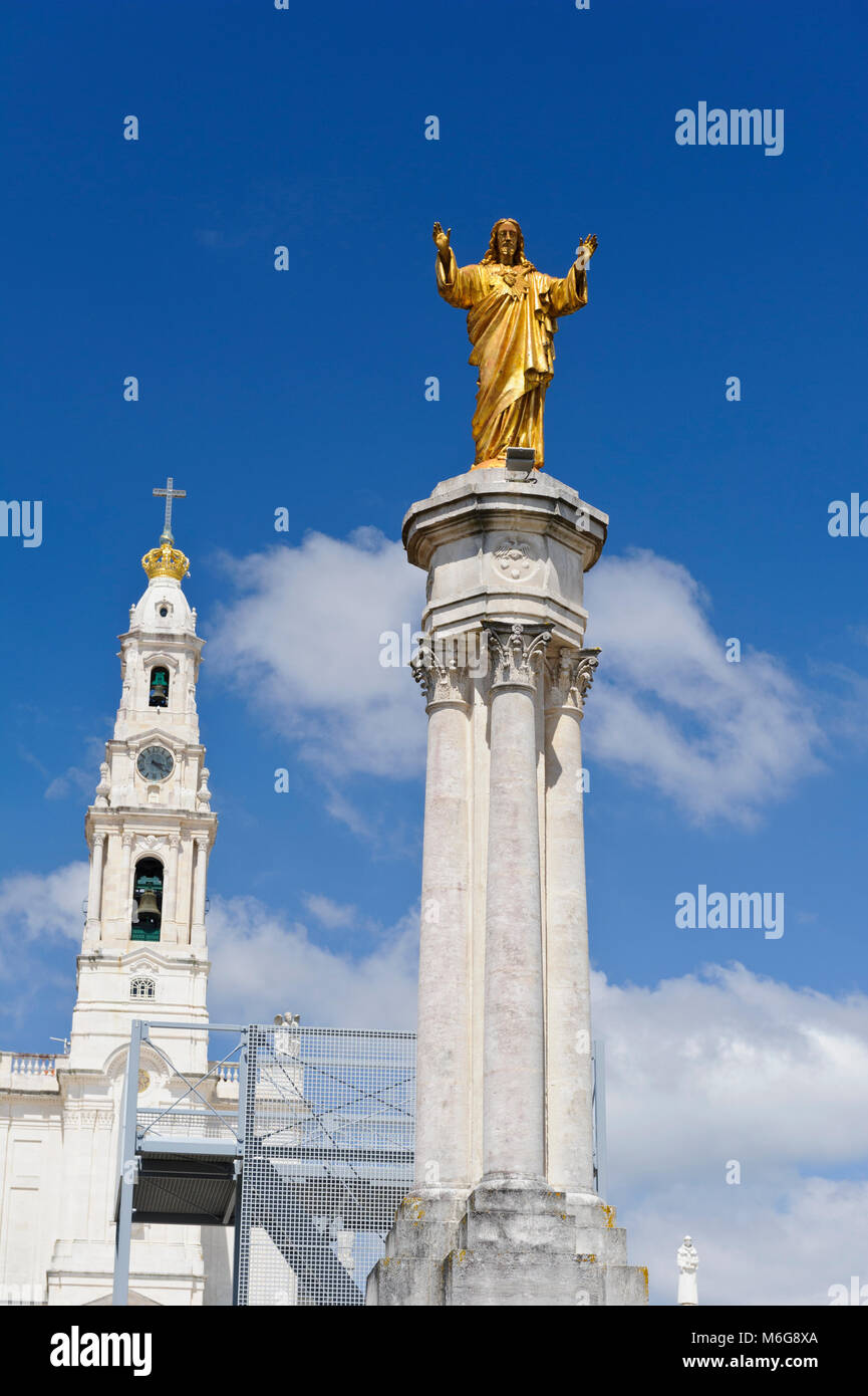 A huge column with a statue of Jesus Christ on top at the Sanctuary of ...