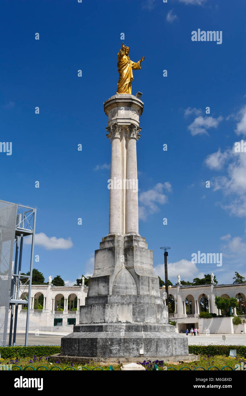 A huge column with a statue of Jesus Christ on top at the Sanctuary of ...