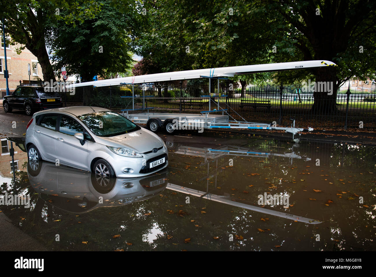 Road Flooded dur to high tide, River Thames at Putney, uk Stock Photo ...