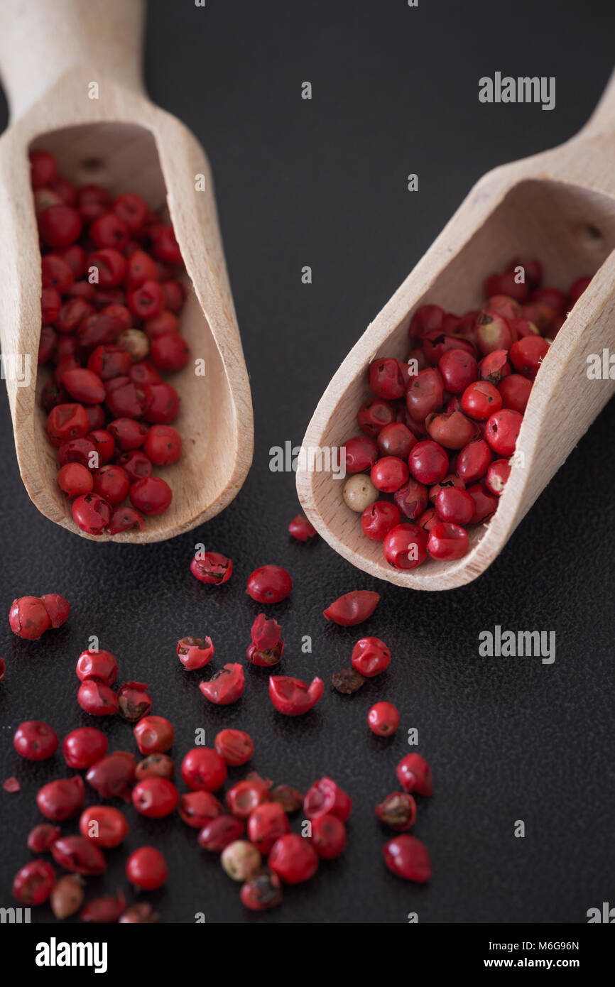 Brazilian pepper on the dark stone Stock Photo - Alamy