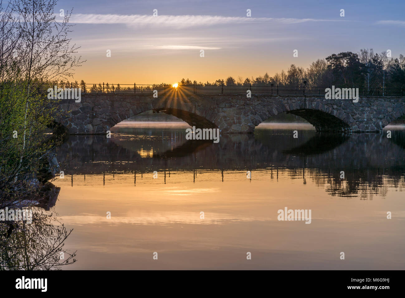 Stone bridge in morning light Stock Photo - Alamy