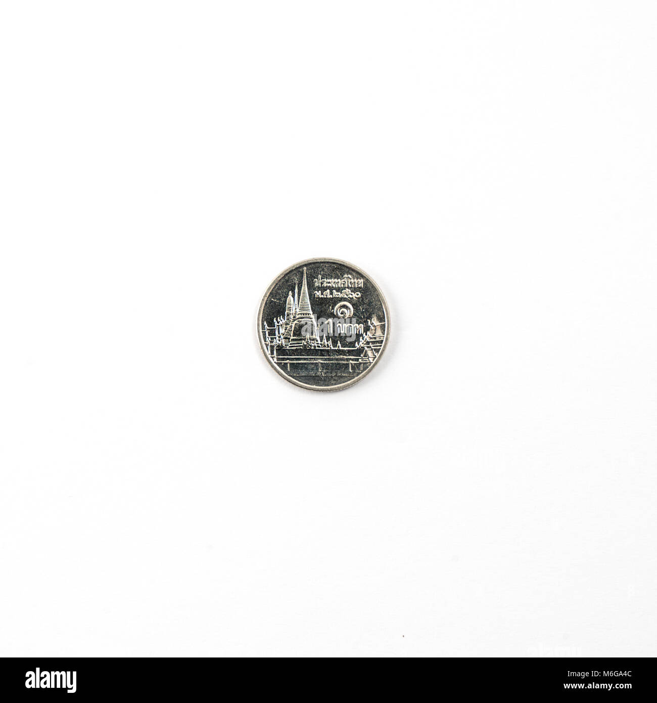 Front and rear of a Thai coin from 1 Bath on a white surface Stock ...
