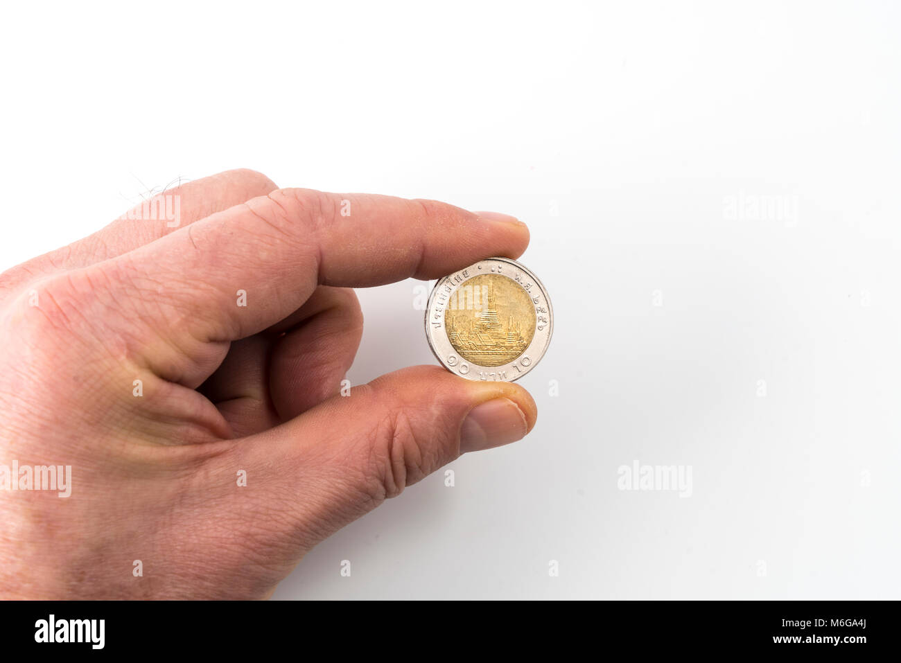 A Thai coin of 10 Bath on a hand Stock Photo - Alamy